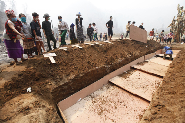 Bangkok Post - Karen victims of refugee fire laid to rest