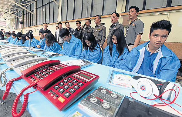 Bangkok Post - China hands over call centre gang suspects