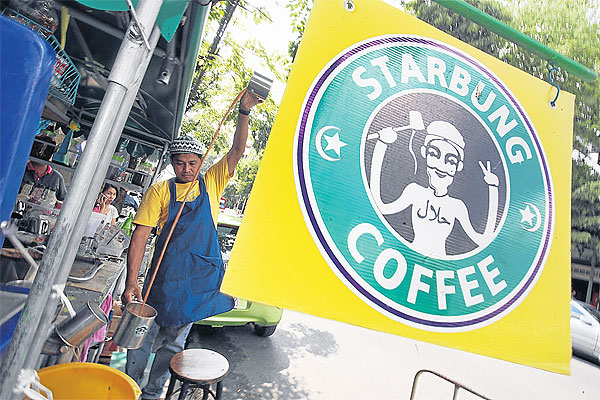 Bangkok Post - Starbucks rival prepared to go to jail over logo fight