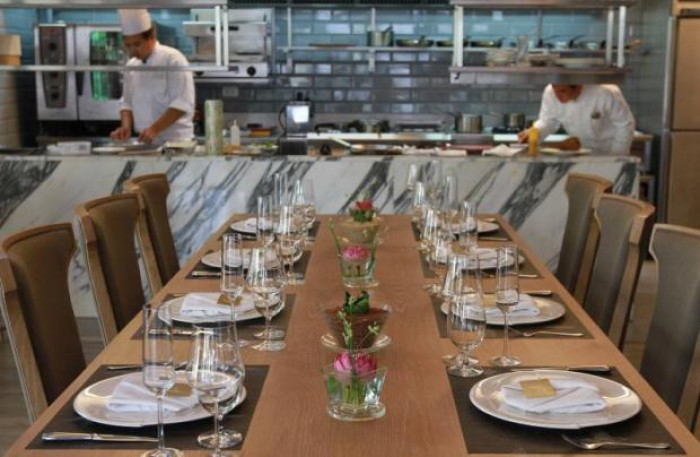 At the head of the Table