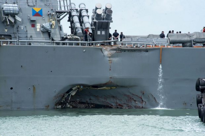 Bangkok Post - Damaged US warship arrives in Singapore, 10 missing