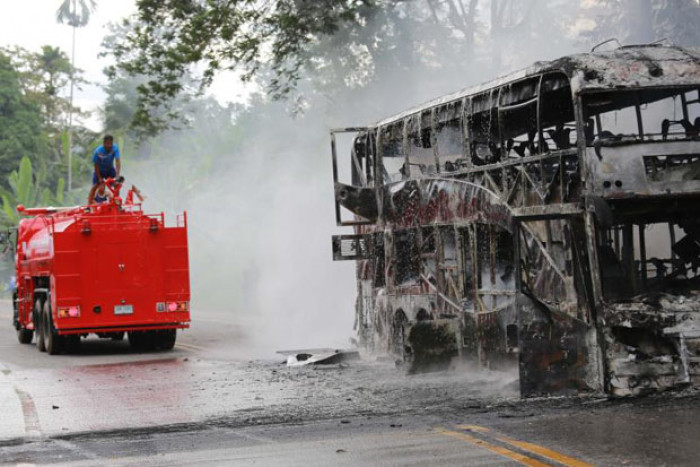 Bangkok Post - Warrants out for 14 suspects in bus arson