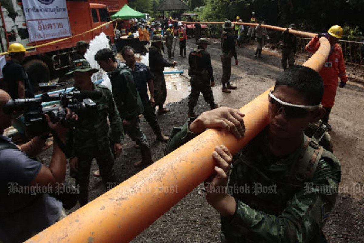 Bangkok Post - Discharged water flows back into flooded cave
