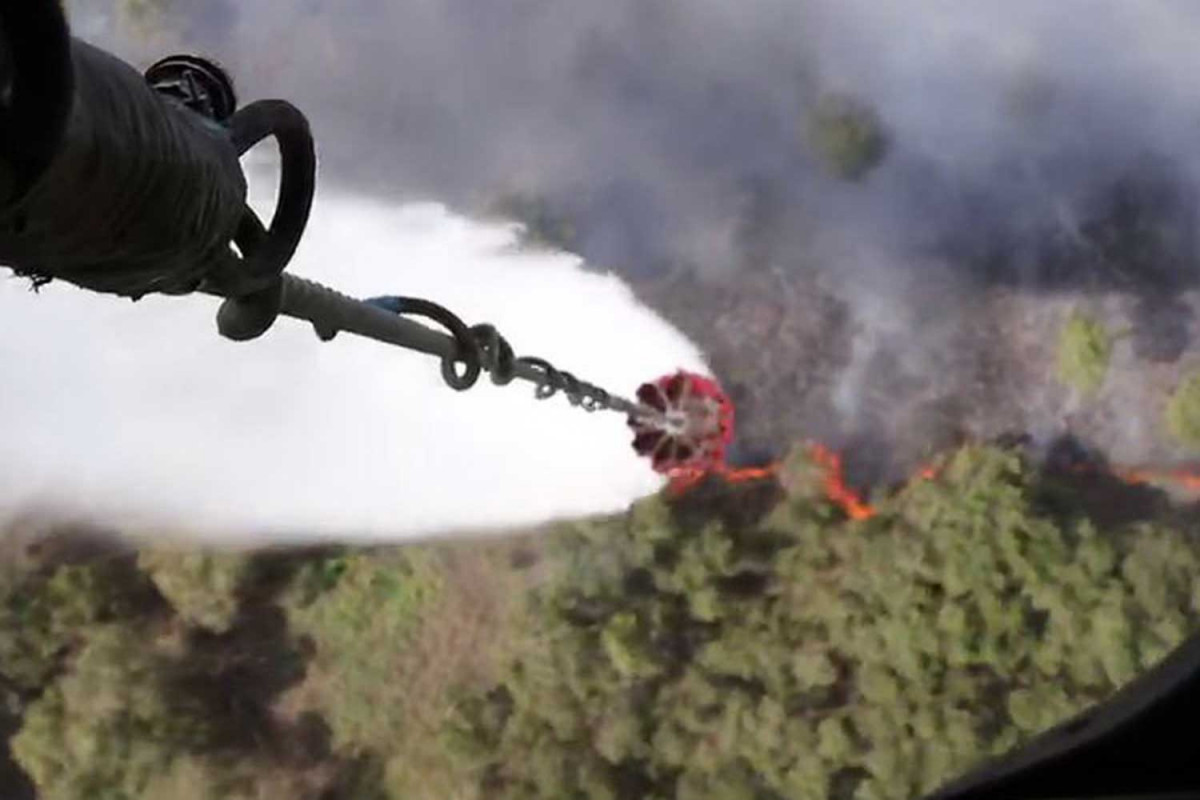 Bangkok Post - Army helicopters begin dousing peat swamp fire