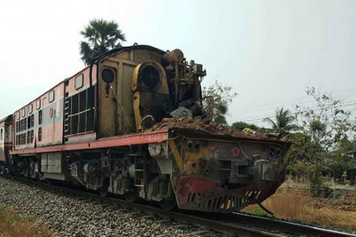 Bangkok Post - Front torn off locomotive as train hits truck on crossing