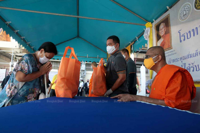 Bangkok Post - Temple kitchens hand out food aid