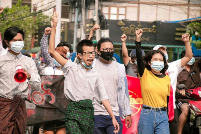 Bangkok Post - Myanmar protesters throw red paint on streets as death ...