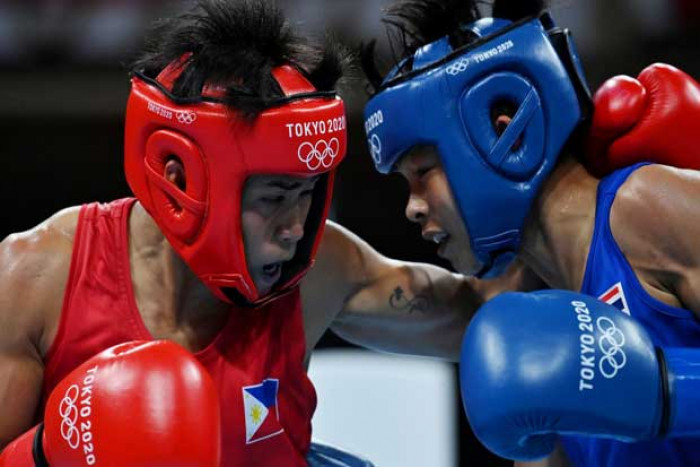 Bangkok Post - New-look Ratchanok, boxer Jutamas reach last 8