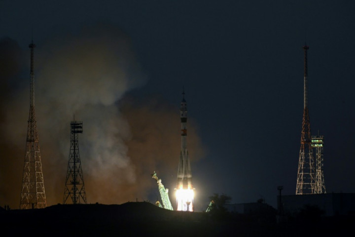 Bangkok Post - American, Russians reach space station as war rages in ...