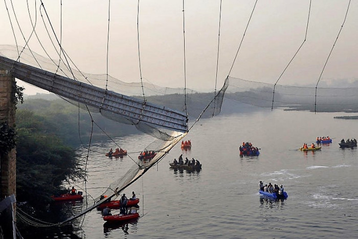Bangkok Post - Factbox: Century-old India hanging bridge collapsed days ...