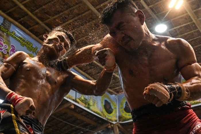 Bangkok Post - Myanmar traditional boxing packs a punch, kick and headbutt