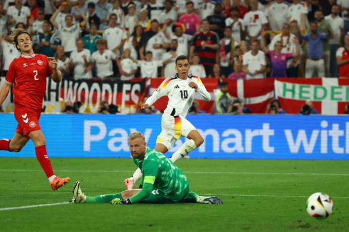 Bangkok Post - Germany weather storm to beat Denmark and reach quarters