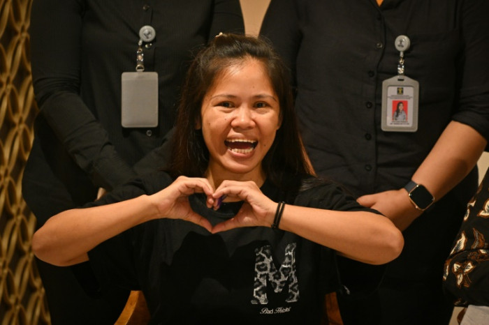 Bangkok Post - Filipina on Indonesia death row flies home to 'new life'