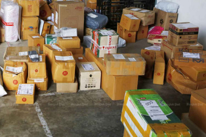 Bangkok Post - Four nabbed in parcel fraud bust in Rayong