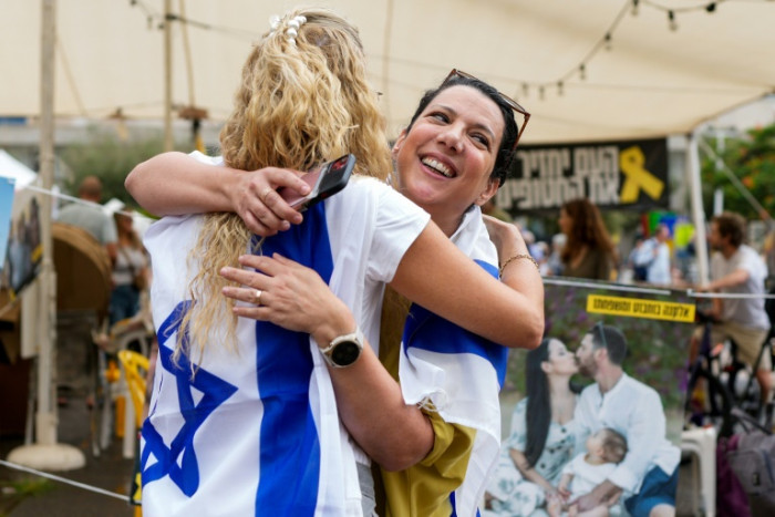 Bangkok Post - ‘They’re coming back’: Israelis await return of hostages