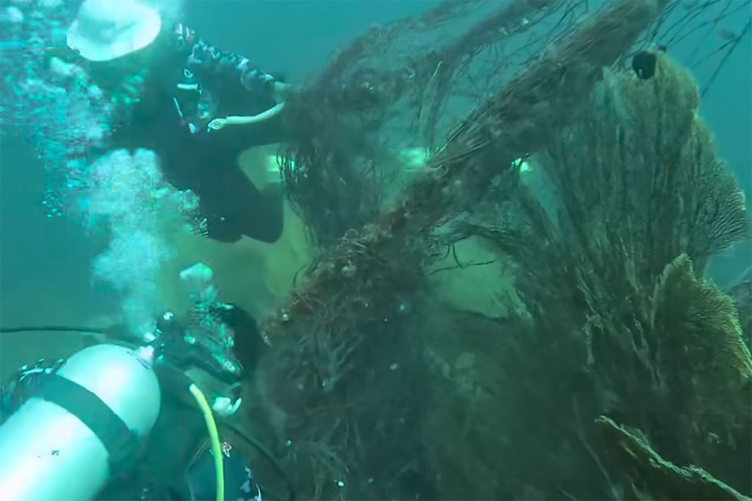 Bangkok Post - Similan divers lift ‘ghost nets’ from deep‑sea coral reef