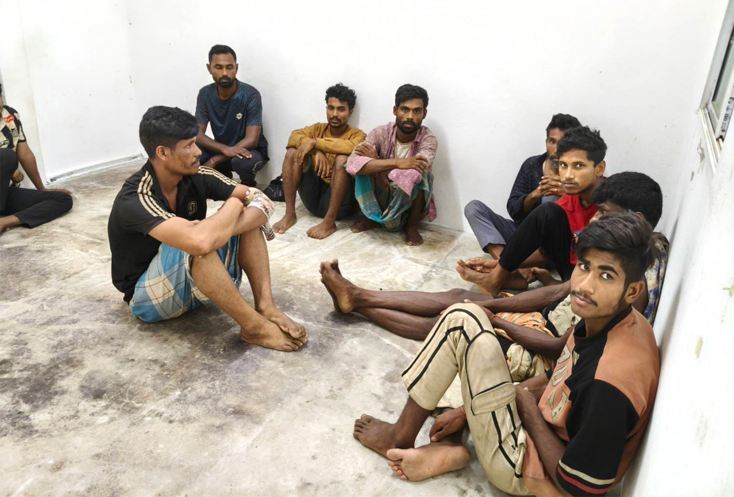 Bangkok Post - Starving Bangladeshi migrants rescued from locked room ...